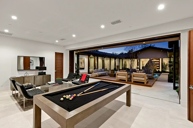 Game room - contemporary gray floor game room idea in San Diego with ...
