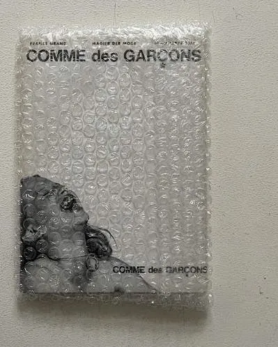 This may contain: a small plastic package with an image of a woman's ...