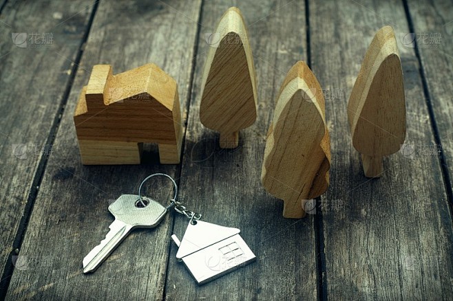 Home key with house keychain and wooden tree mock