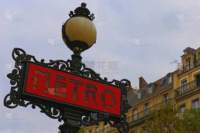 Typical french metro station sign and Parisian architecture – Paris, France