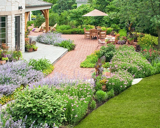 This is an example of an expansive classic back full sun garden for ...