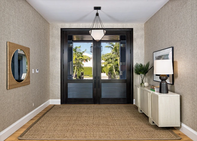Entryway - coastal medium tone wood floor, brown floor and wallpaper ...