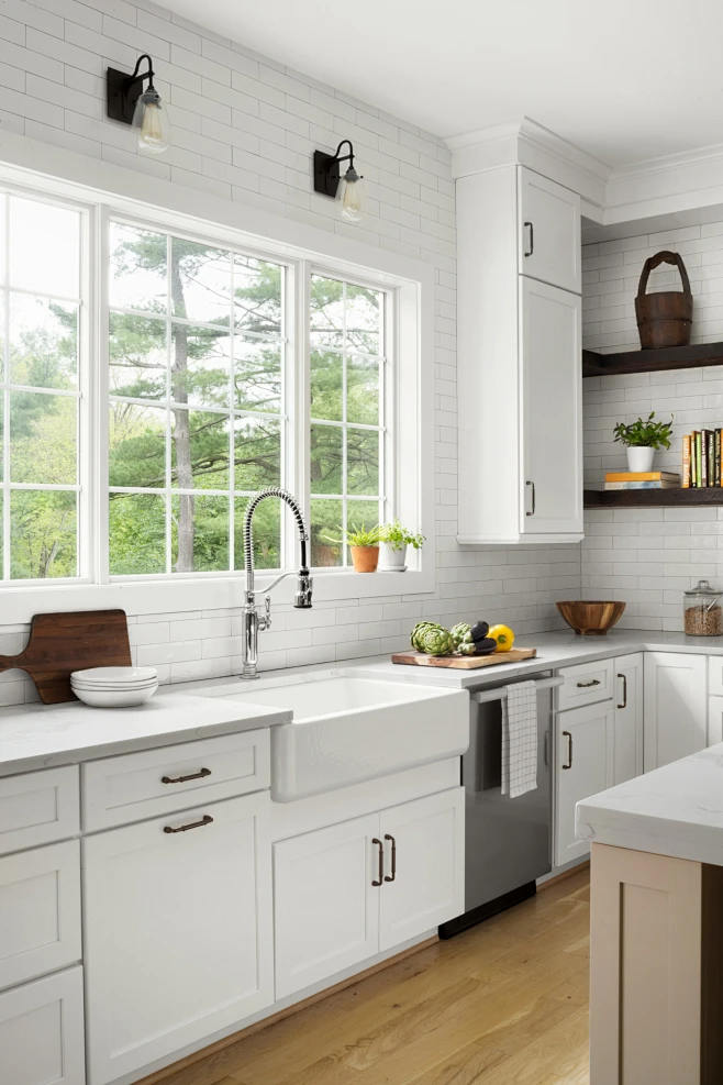 Example of a transitional light wood floor kitchen design in DC Metro ...