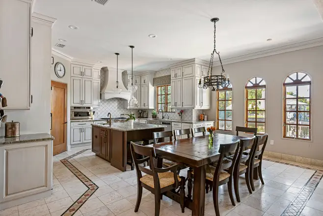 Inspiration for a large mediterranean u-shaped ceramic tile and beige ...