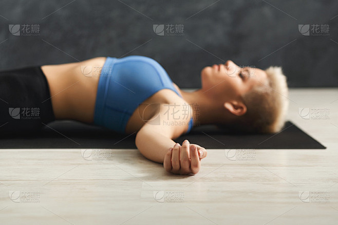 Woman having rest after training yoga in gym