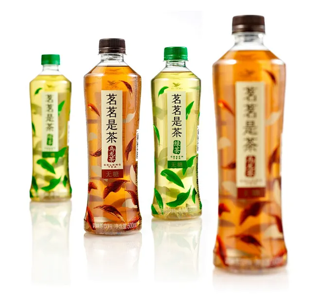 This may contain: three bottles of tea with leaves on the top and ...