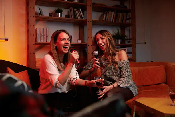 Talented girls with beautiful voices sit at home and sing a duet at ...