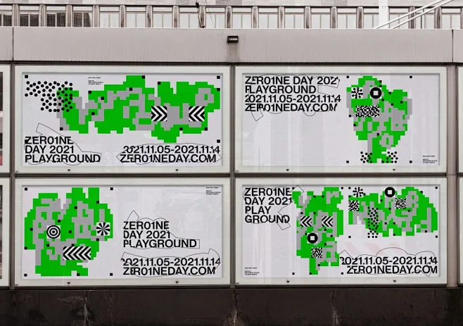 This may contain: several posters on the side of a building with green ...