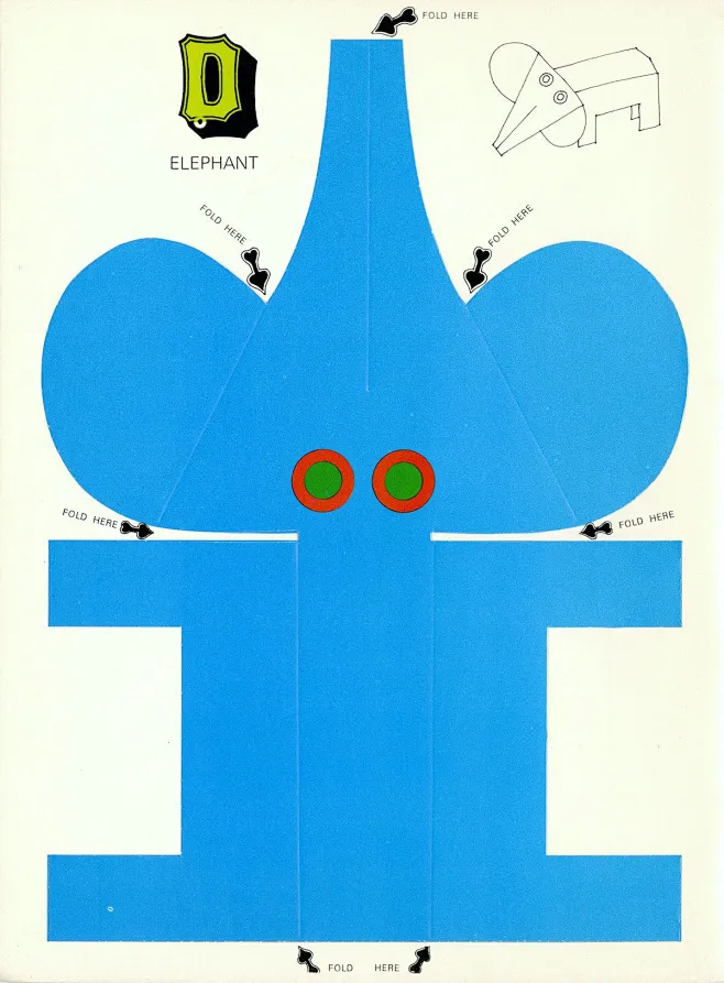 This may contain: a blue paper cut out with red eyes and two green ...