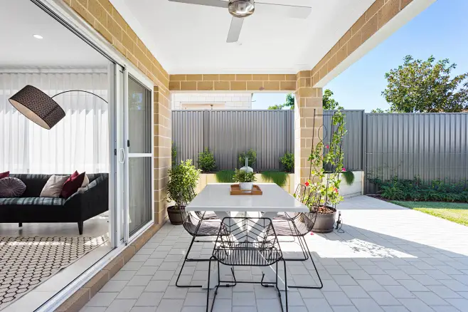 Trendy backyard concrete paver patio container garden photo in Perth ...