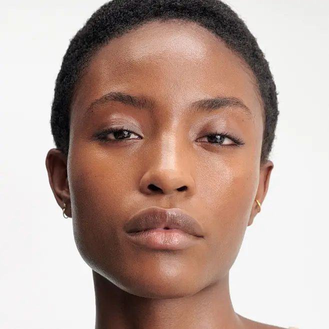 Deep Skin Tone/Red Undertone model wearing Skin Enhance Luminous Tinted ...