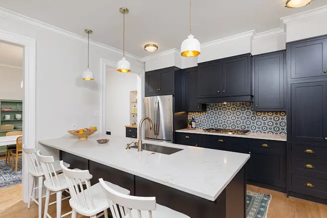 Example of a transitional light wood floor enclosed kitchen design in ...