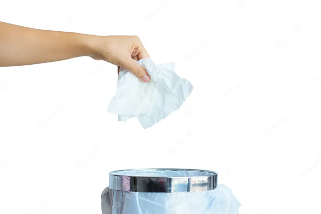 Women hand throwing white tissue paper in to a trash bin on white ...