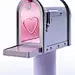 C4D render of an open mailbox with a heart symbol on the side, white ...