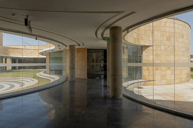 elliptical stone-clad galleries by ini design studio compose science ...