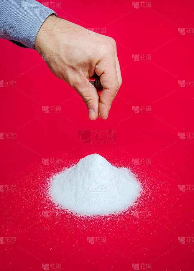 Salt sprinkled on a red dangerous background sugge