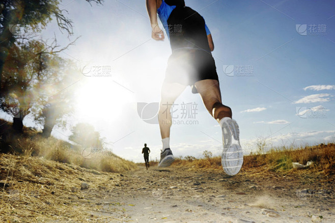 Silhouette of young sport man running off road cro