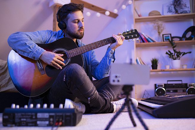 man-making-music-home-full-shot