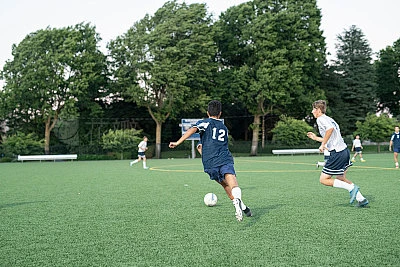 Ethnic soccer player looks for a teammate to pass to during a matchA ...