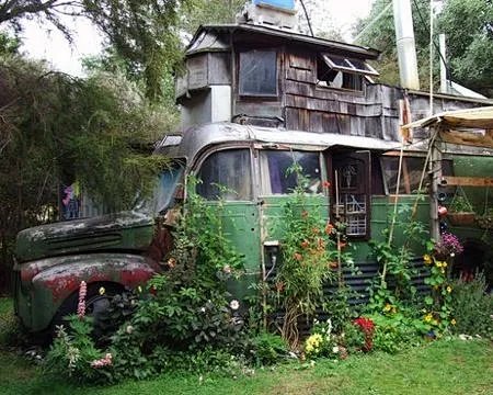 junk car in your yard got you down? build a cabin on top of it and put ...