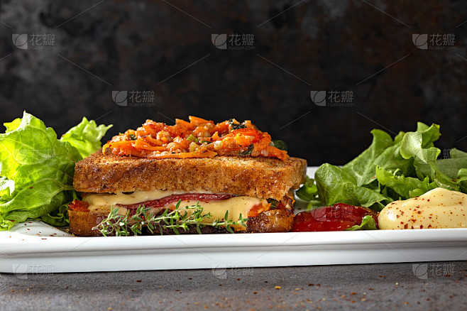 Worm sandwich made with cheese, salami and vegetab