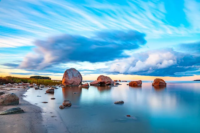 Bright colored sea sunset with stones along the coast by Nick Yegorov ...