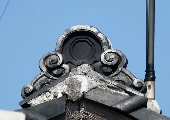 This may contain: the top of an old building with a weather vein on it ...