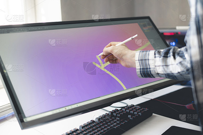 young male digital artist drawing paint on the com