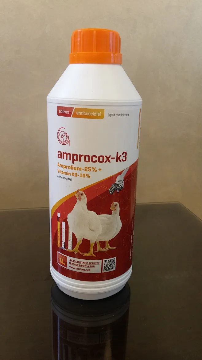 This may contain: a bottle of amprocox - k3 on a table with a black ...