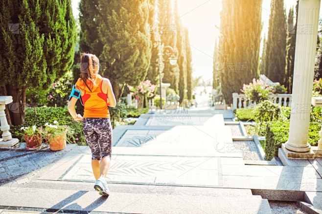 woman running around in the park in the morning