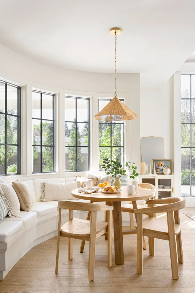 Kitchen nook with bench and round table with rattan pendant-花瓣网