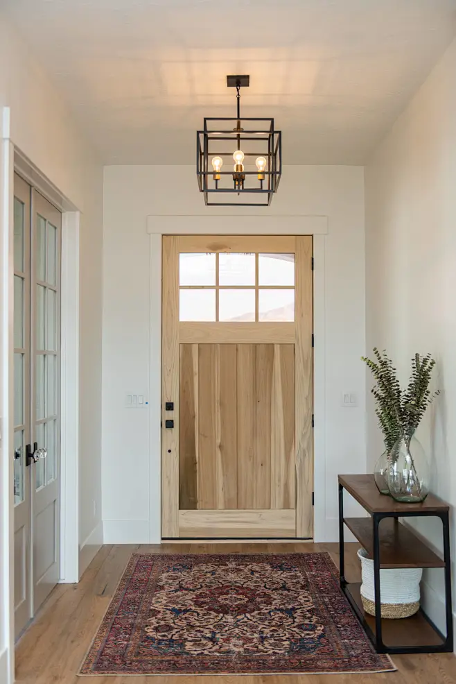 Mid-sized transitional light wood floor and brown floor entryway photo ...