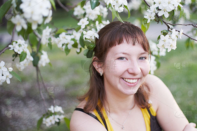 Spring. Portrait girl. White flowers of an apple