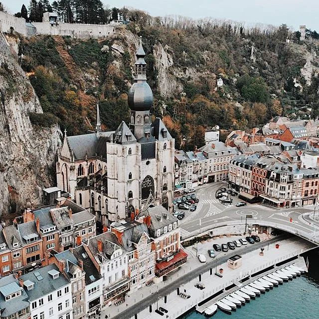 On a slim stretch of land between steep cliffs and the Meuse River sits ...