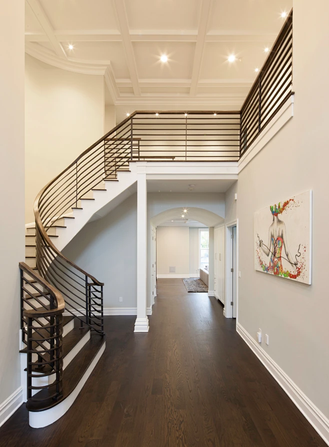 Staircase - large transitional wooden curved metal railing staircase ...