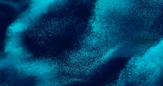 A swirling pattern of vibrant teal and dark blue particles creates a ...