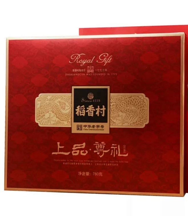 two red folders with chinese writing on the front and back covers, one ...