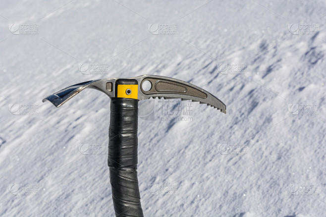 Ice axe – pick, head, adze and shaft with wrapped tape on the ...