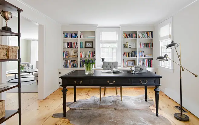 Example of a mid-sized transitional freestanding desk light wood floor ...