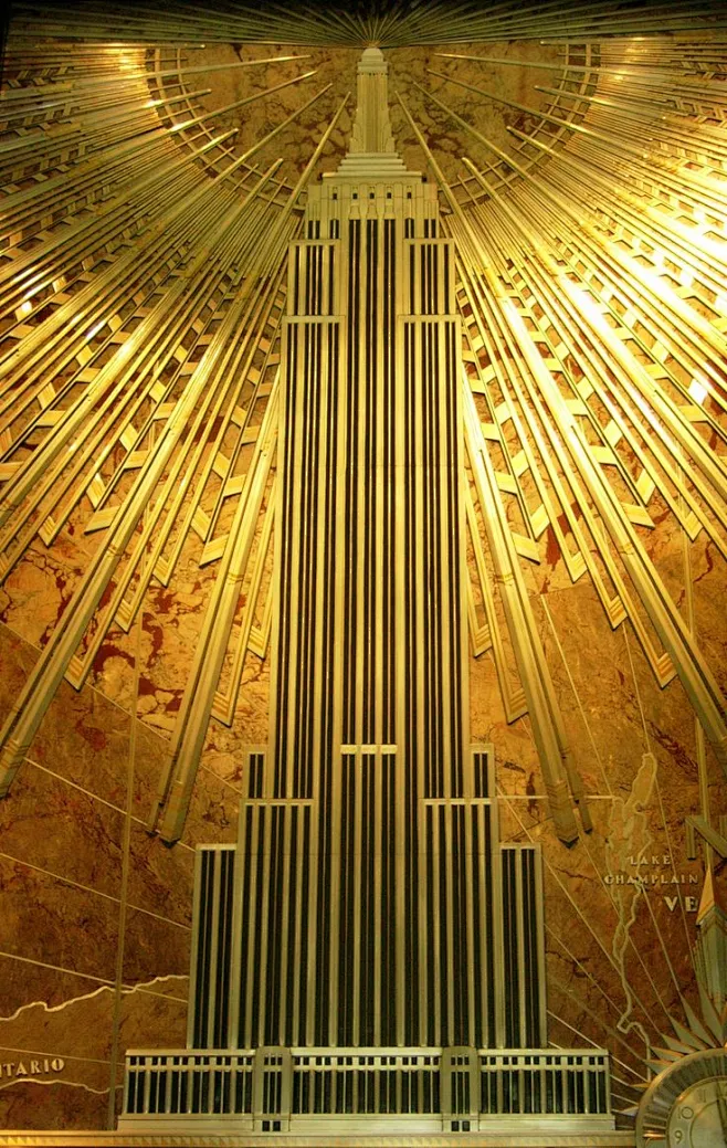 The doors of the Empire State Building lobby elevators depict the ...