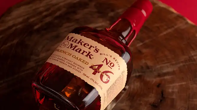 A Manhattan cocktail made with Maker's Mark 46 sits on a table with the ...