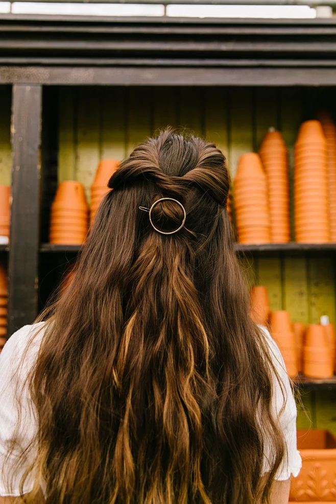 This gold circle clip is the perfect accessory to pull you hair back ...