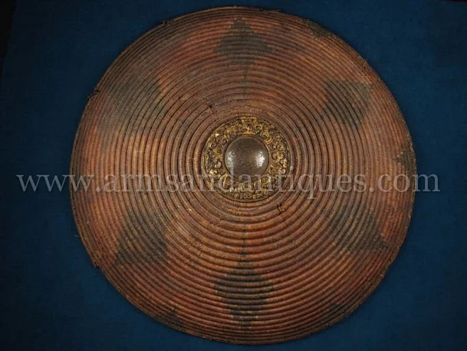 Excellent 16th C. Tibetan Domed Cane Shield, with iron and gilded brass ...