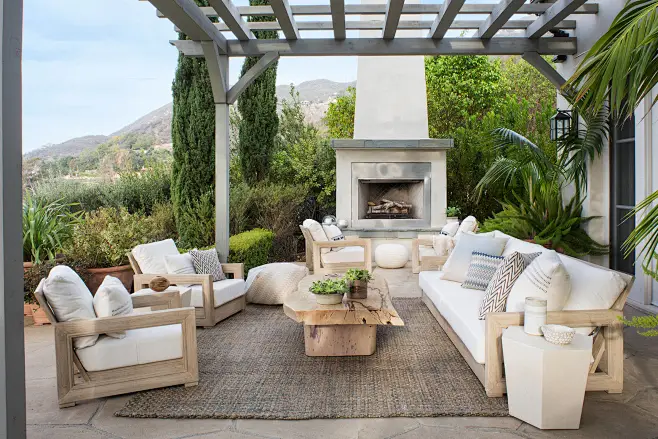 Example of a mid-sized beach style backyard stone patio design in Santa ...