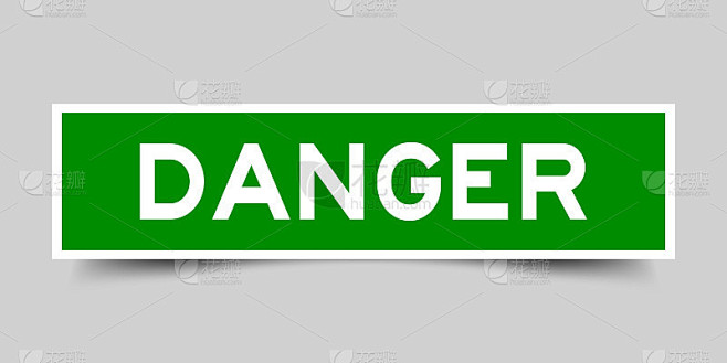 Square green danger sticker label in word on gray