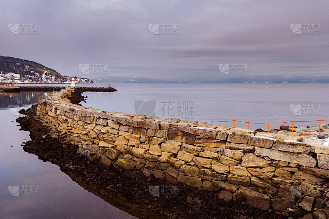 Quay wall with lighthouse of the Trondheim port on