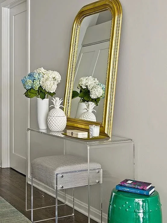 Simple yet elegant contemporary foyer showcases a gorgeous lucite stool ...