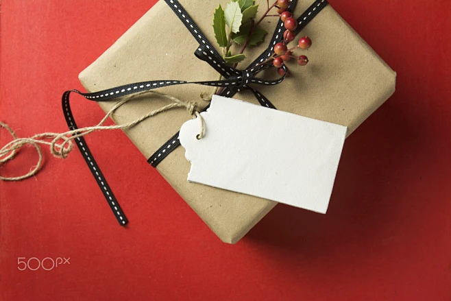 Christmas Gift box, wrapped in recycled paper, black bow with em by ...