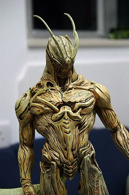 This may contain: a close up of an action figure made out of wood and ...